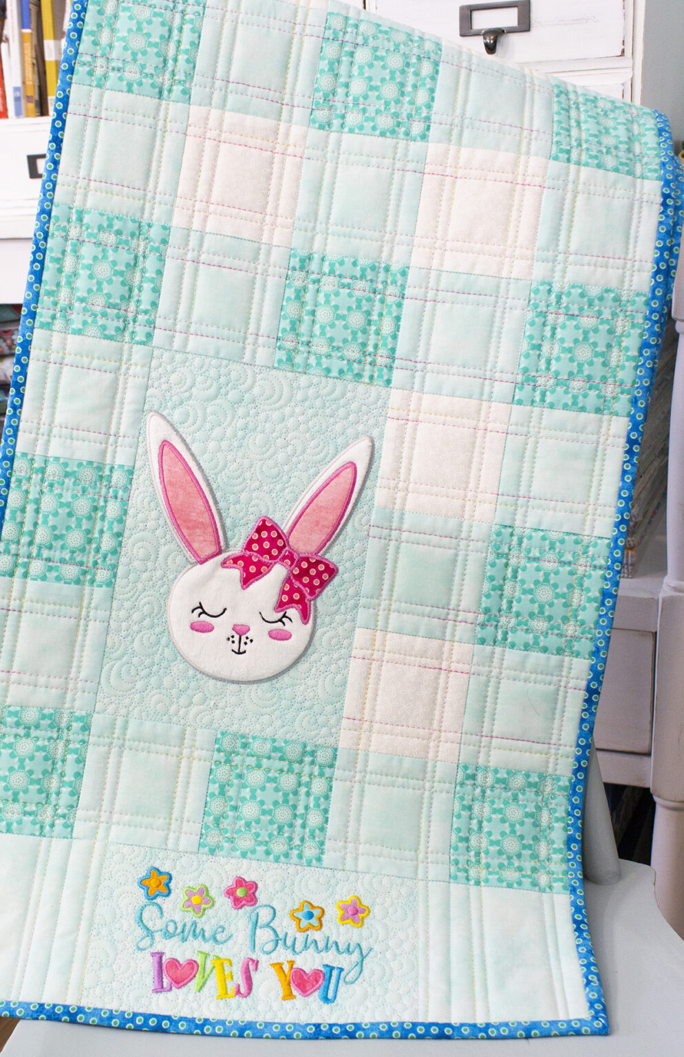 A quilted fabric with a cute bunny patch and bow. - Sulky
