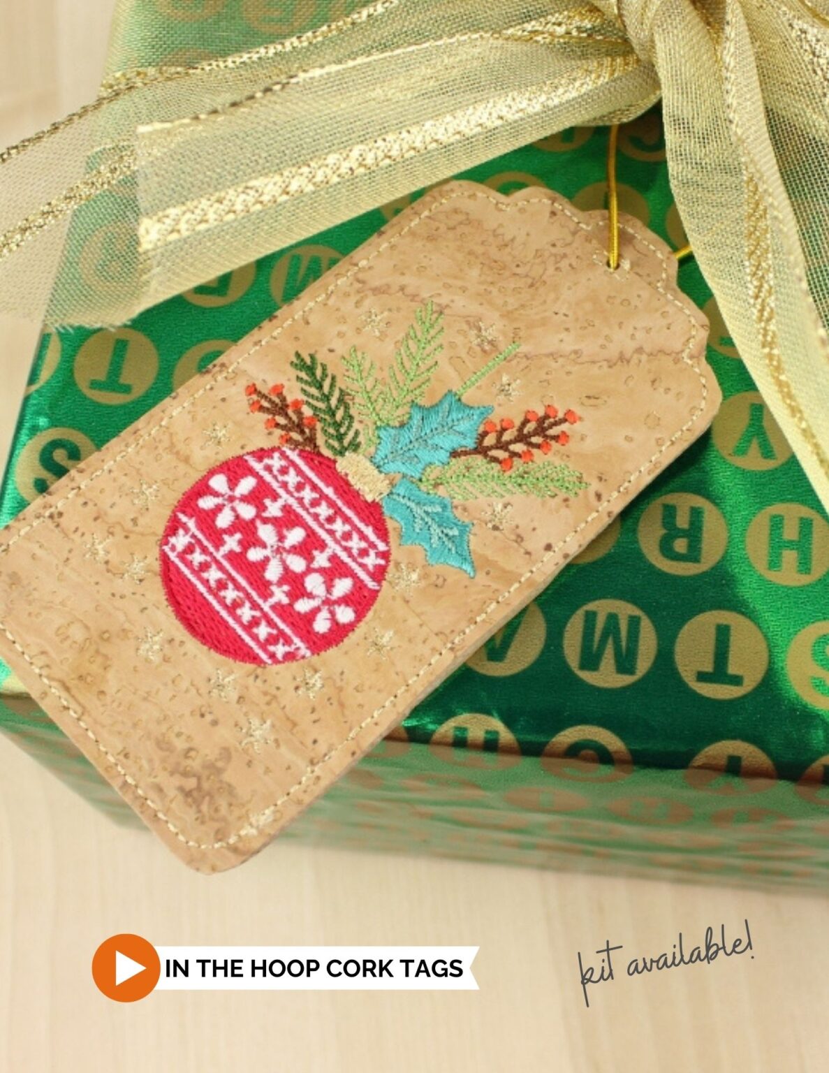 A burlap gift bag with a red ornament design and lace ribbon. - Sulky